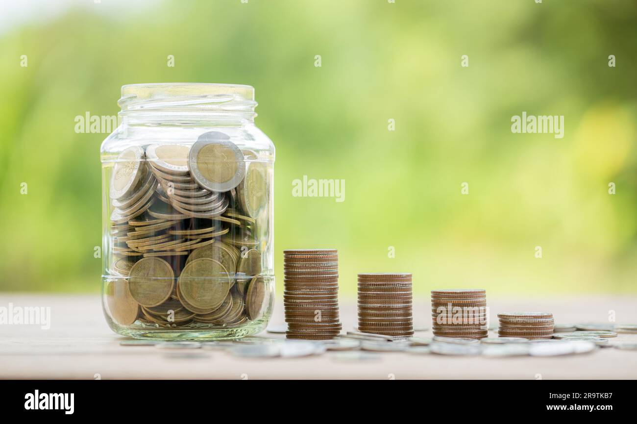 Savings for business investments concept. Money coin stacking on wood ...