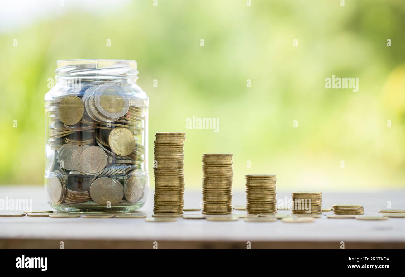 Savings for business investments concept. Money coin stacking on wood ...