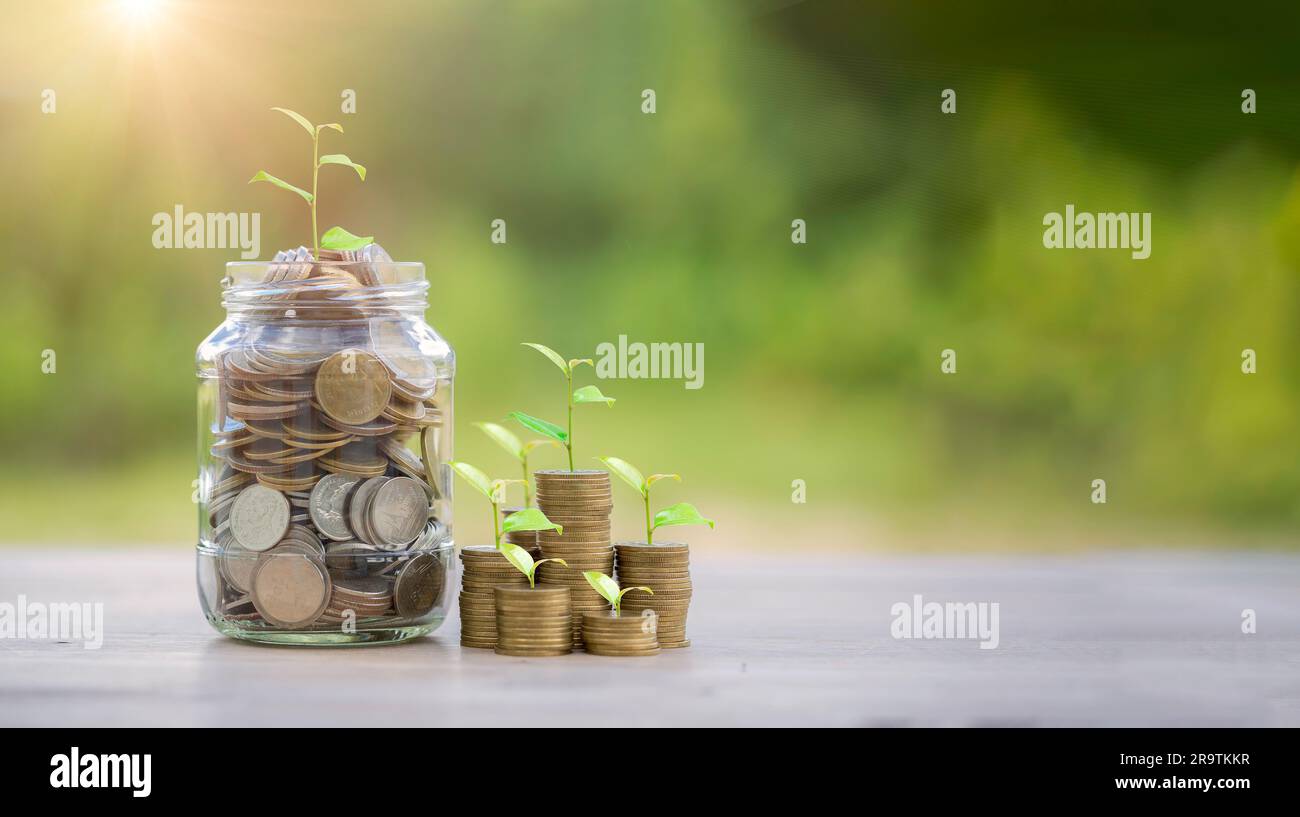 Money coin stack growing graph with glass jar saving concept. business ...
