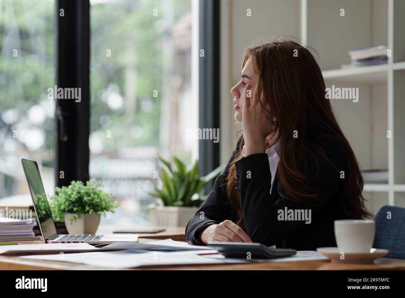 Stressed and Burnout. Business woman worry about her work at office ...