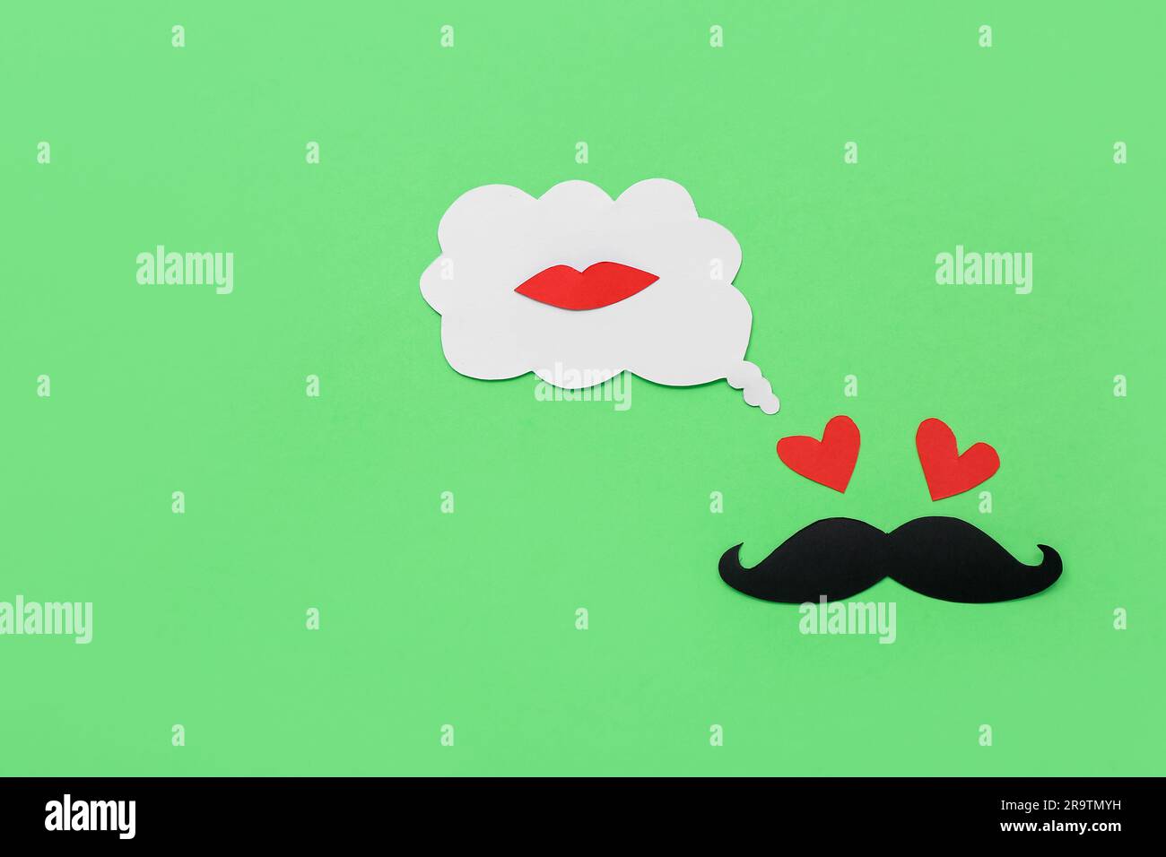 Paper male face and speech bubble with lips on green background ...