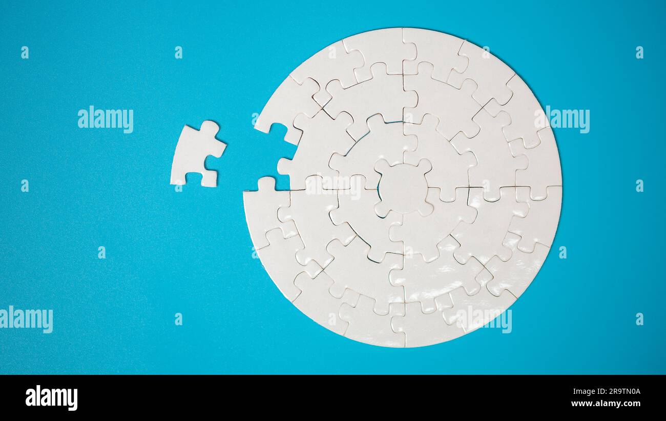 White part of jigsaw puzzle pieces on blue background. concepts of ...