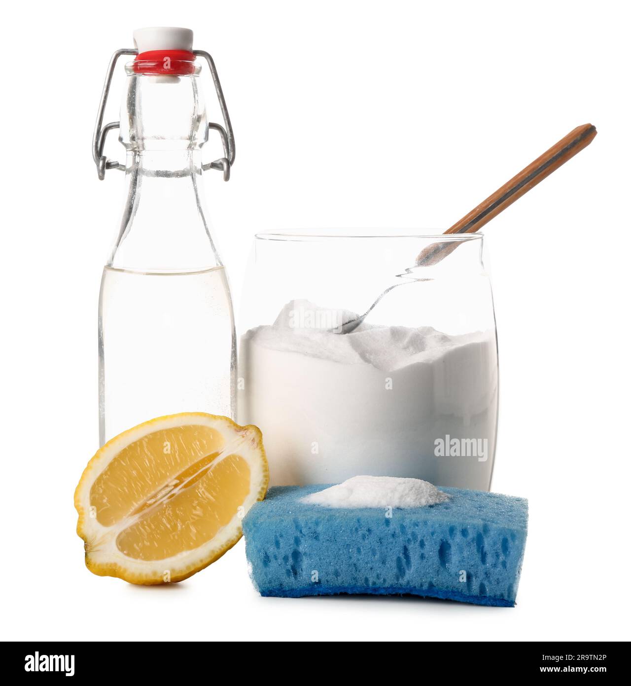 Jar with baking soda, bottle of vinegar, cleaning sponge and lemon on ...