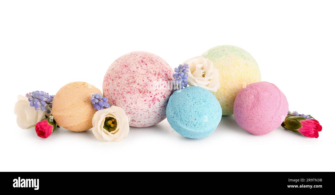 Bath bombs with flowers on white background Stock Photo - Alamy