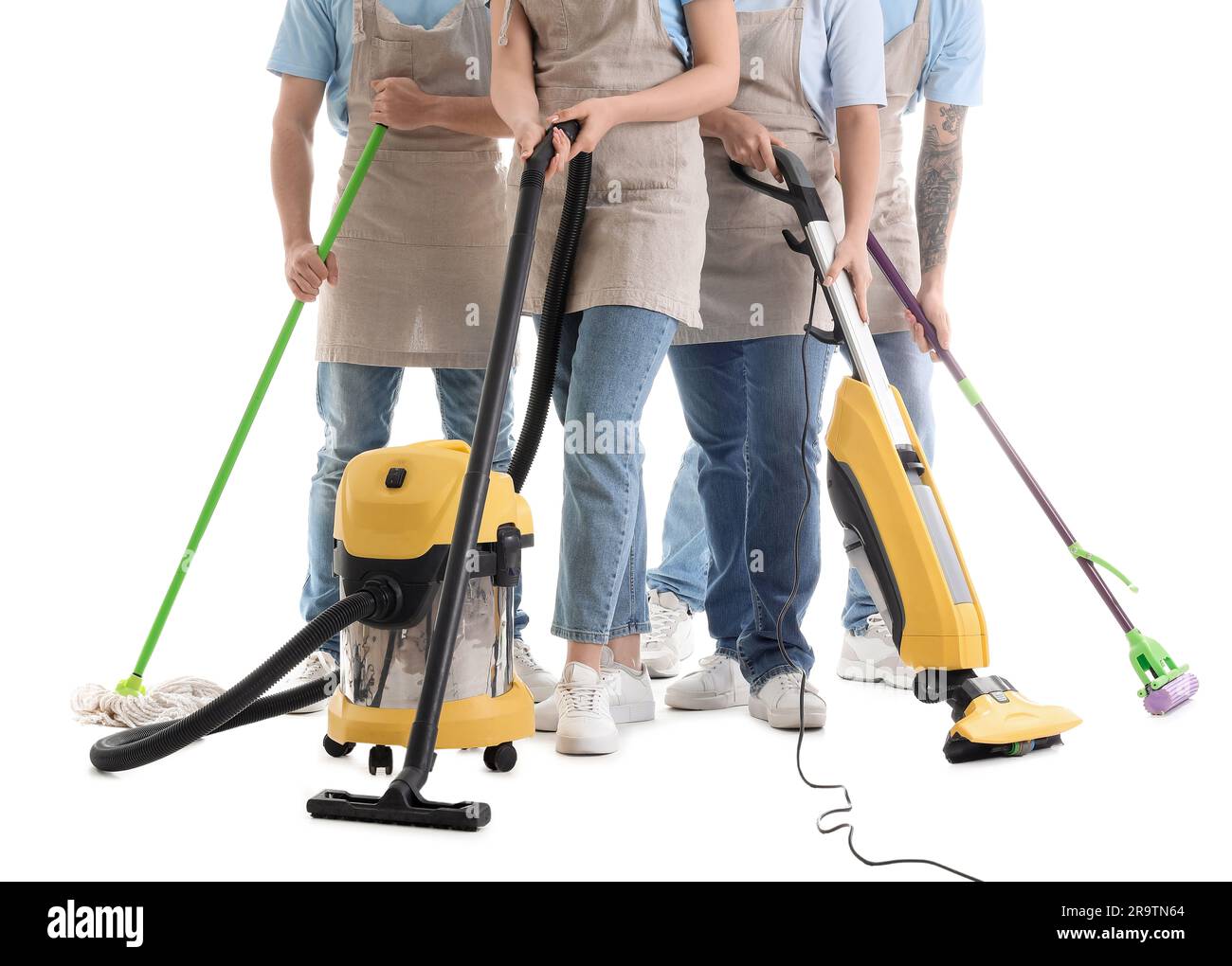 Young janitors with cleaning supplies on white background Stock Photo ...