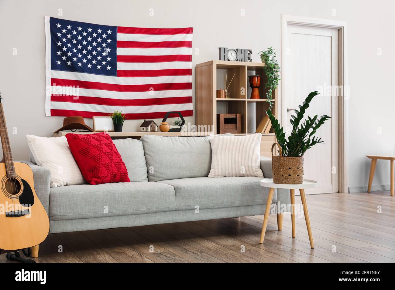 Interior of modern living room with hanging USA flag Stock Photo - Alamy