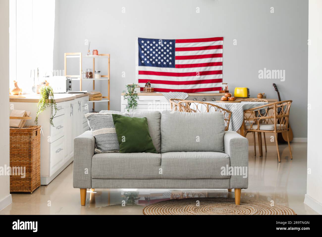 Interior of stylish kitchen with hanging USA flag Stock Photo - Alamy