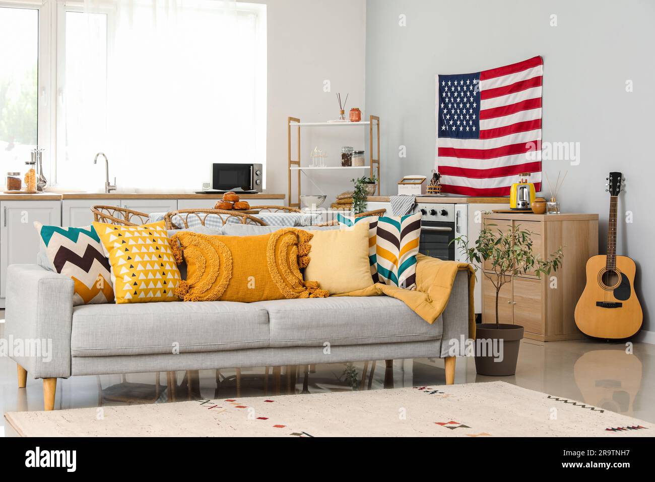 Interior of modern kitchen with hanging USA flag Stock Photo - Alamy