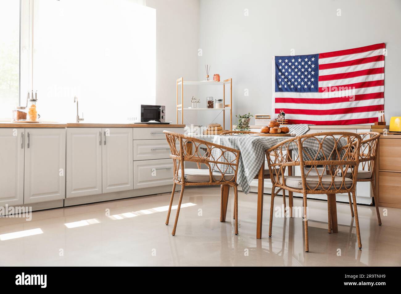Interior of stylish kitchen with hanging USA flag Stock Photo - Alamy