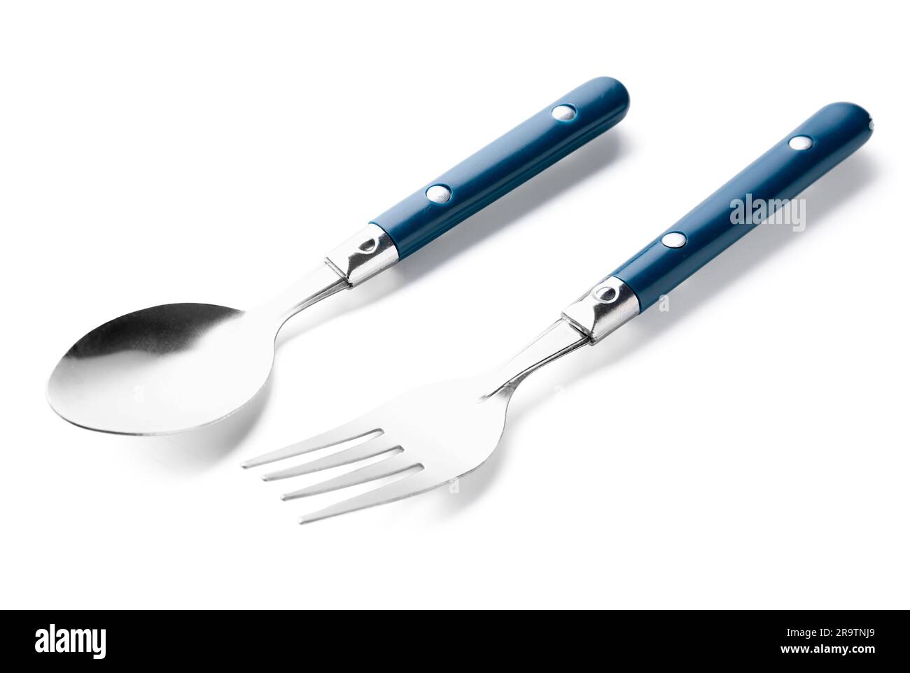 Stainless steel fork and spoon with blue handles on white background ...