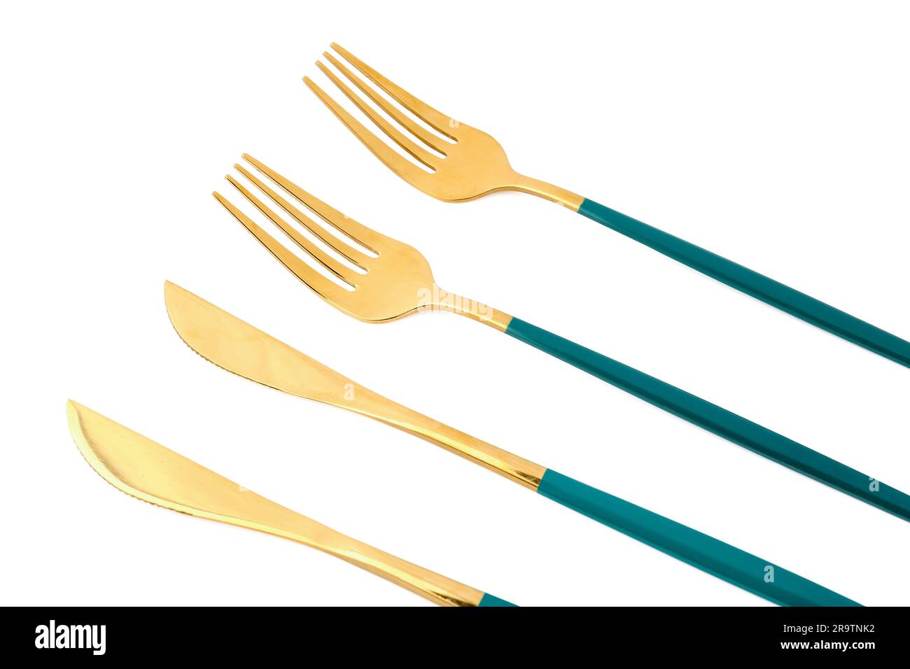 Golden forks and knives with green handles on white background Stock ...