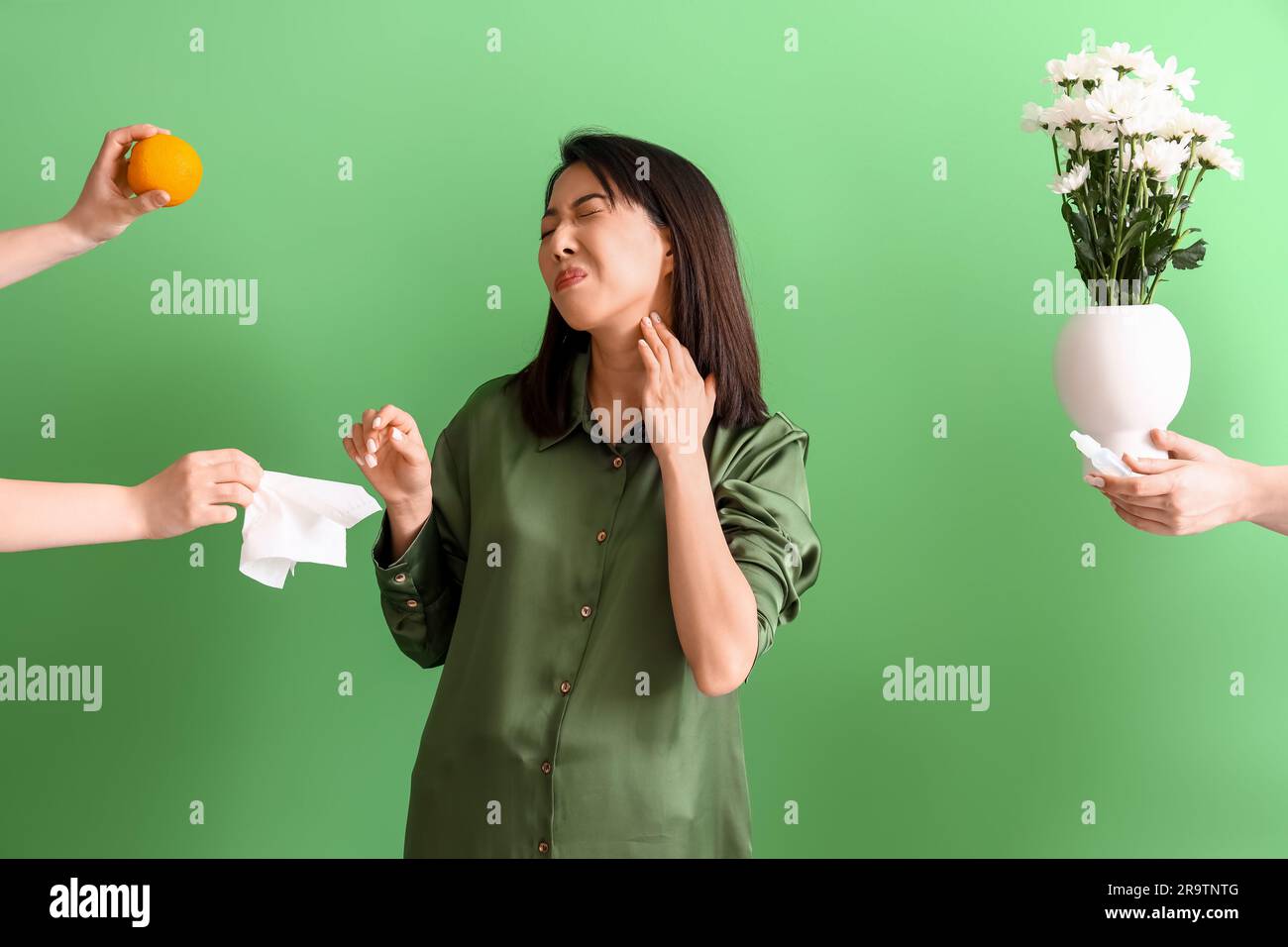 Allergic Asian woman and female hands with allergens on green ...