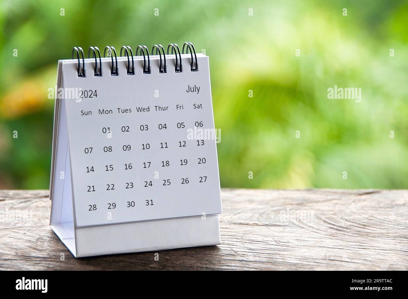 July 2024 white table calendar with customizable space for text ...