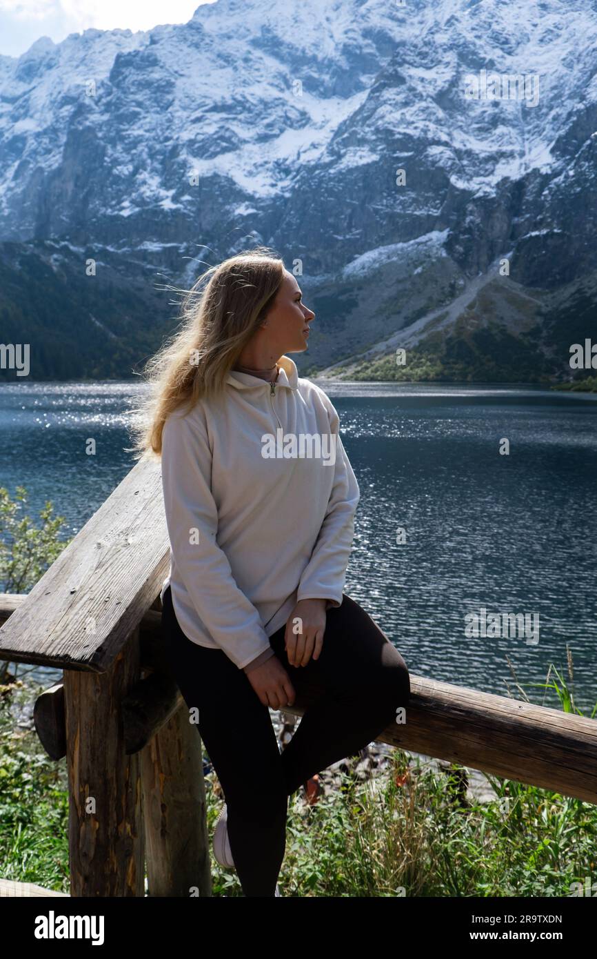 Young woman enjoying nature in Morskie Oko Snowy Mountain Hut in Polish ...