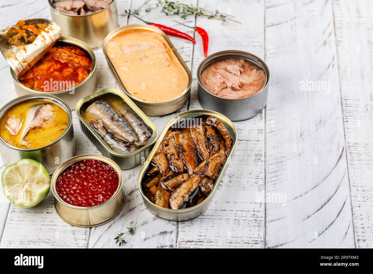 Variety of opened cans with different types of fish and seafood Stock ...
