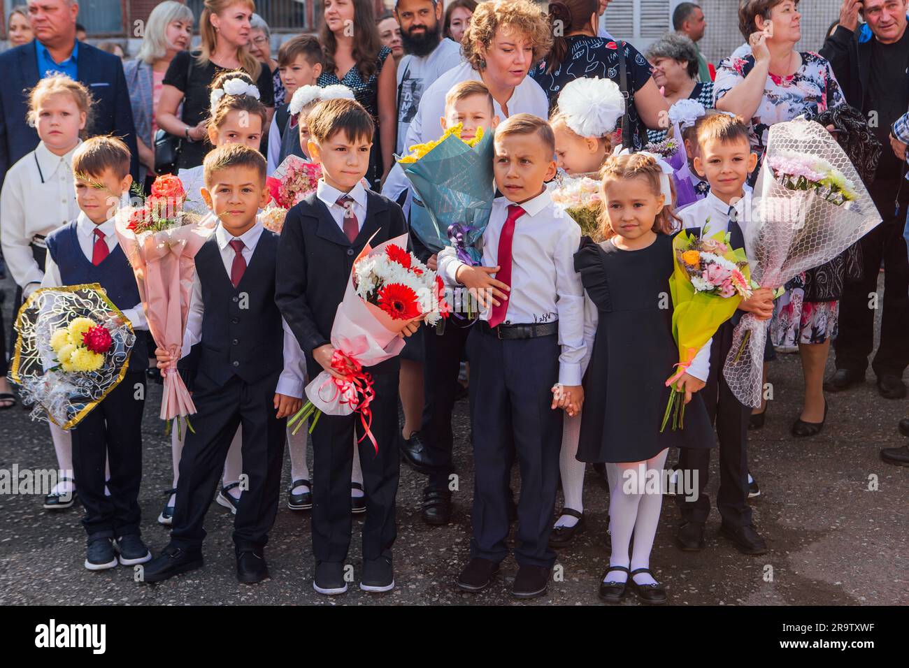 Meeting with the first-grade pupils and teacher at schoolyard. The day ...
