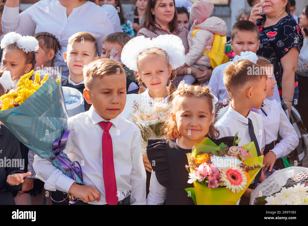 Meeting with the first-grade pupils and teacher at schoolyard. The day ...