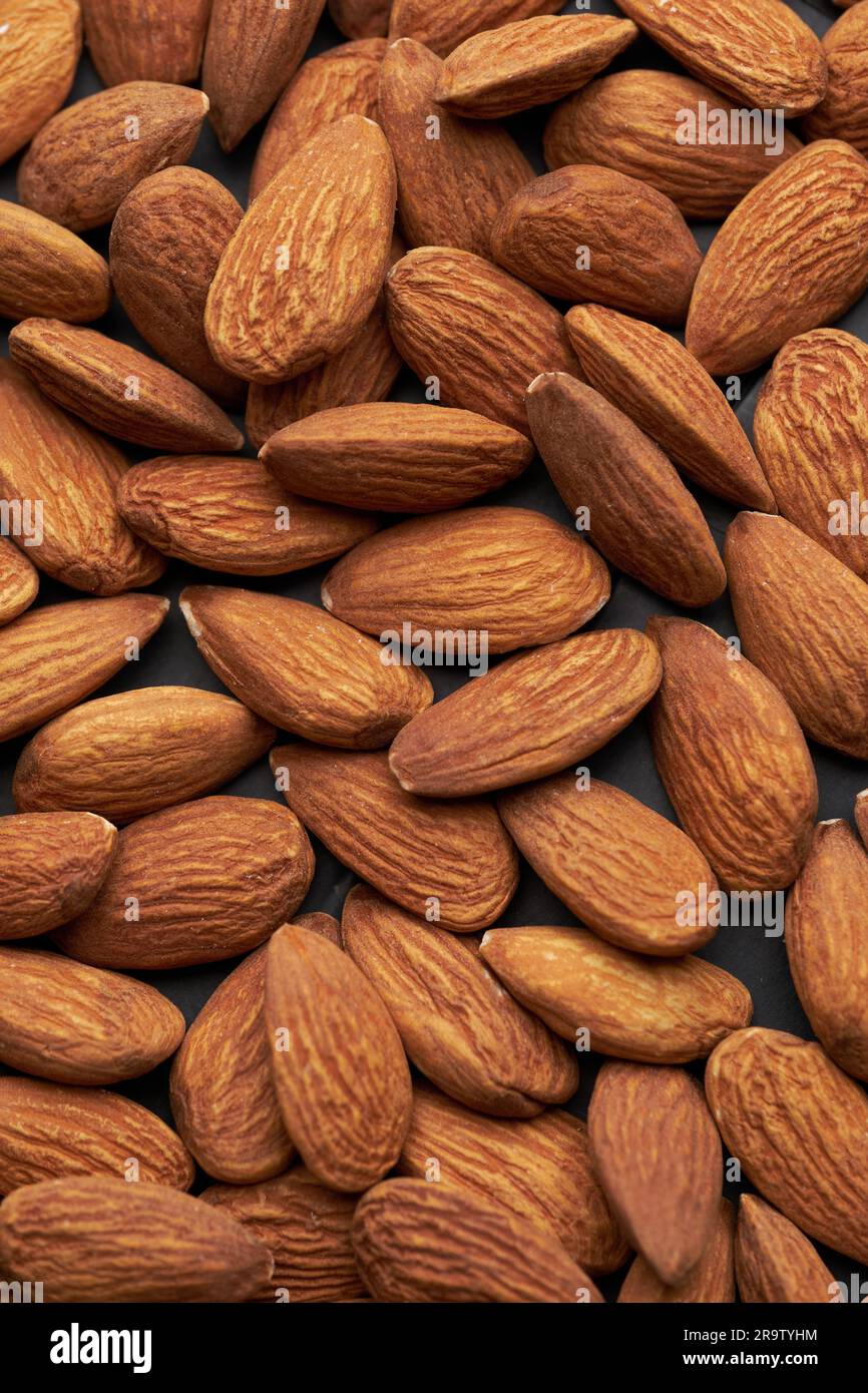 Whole shelled almond nuts kernels studio background Stock Photo - Alamy