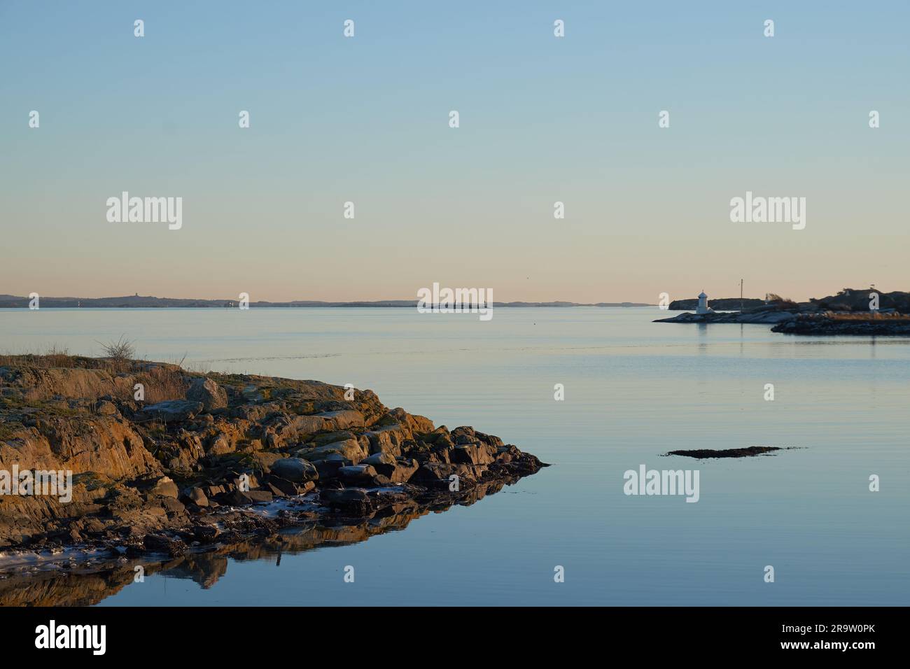 A Swedish archipelago with calm sea and scaurs and a lighthouse Stock ...