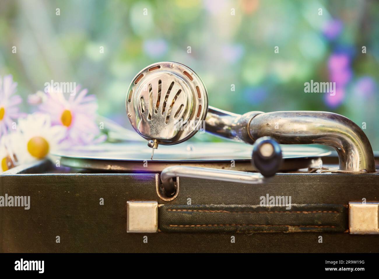 Vintage shot of a retro gramophone with a vinyl record and a romantic ...
