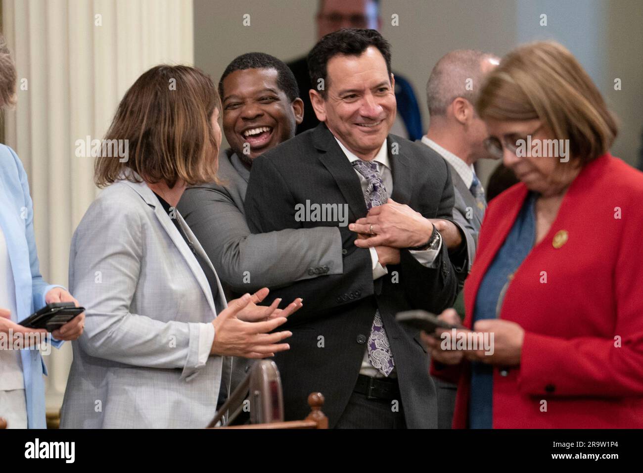 FILE – Assemblymember Corey Jackson, second from left, gives Assembly ...