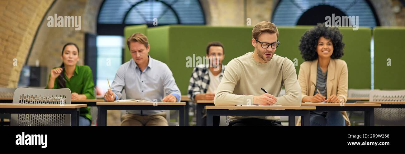 Corporate training. Group of multiracial people sitting in the modern ...