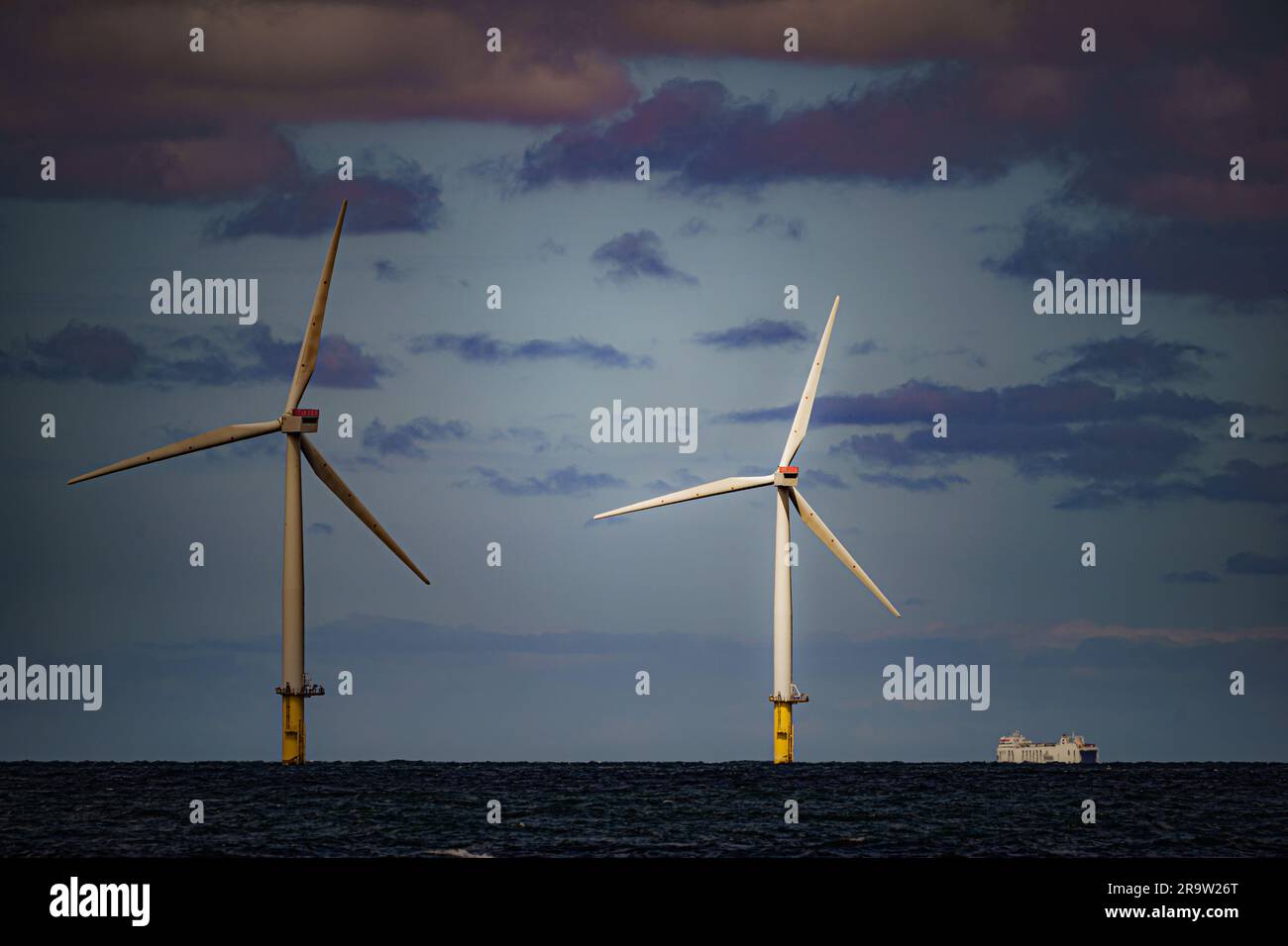 File photo dated 26/07/2022 of a ship passing wind turbines at RWE's ...