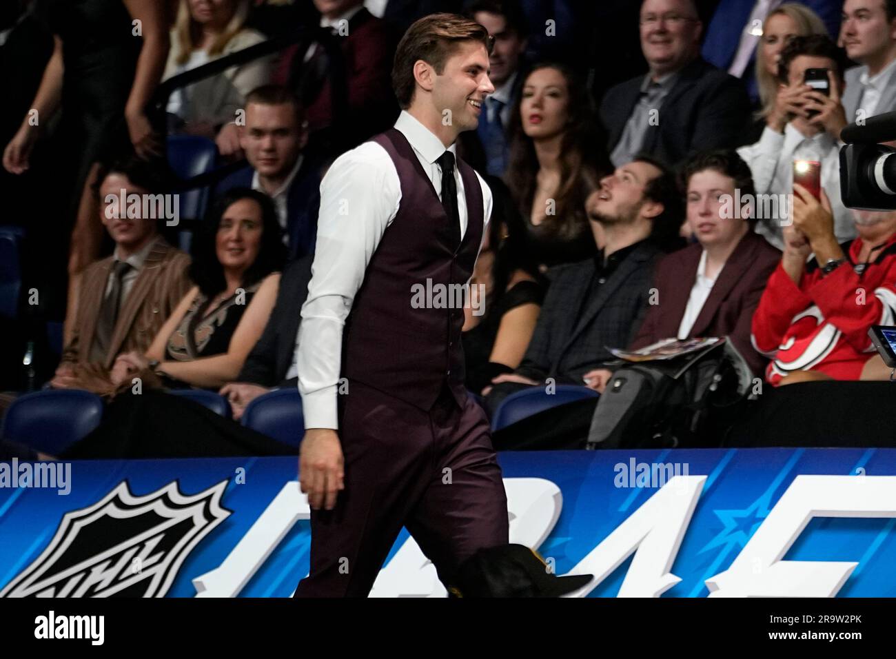 Columbus Blue Jackets first round pick Adam Fantilli walks to the stage ...