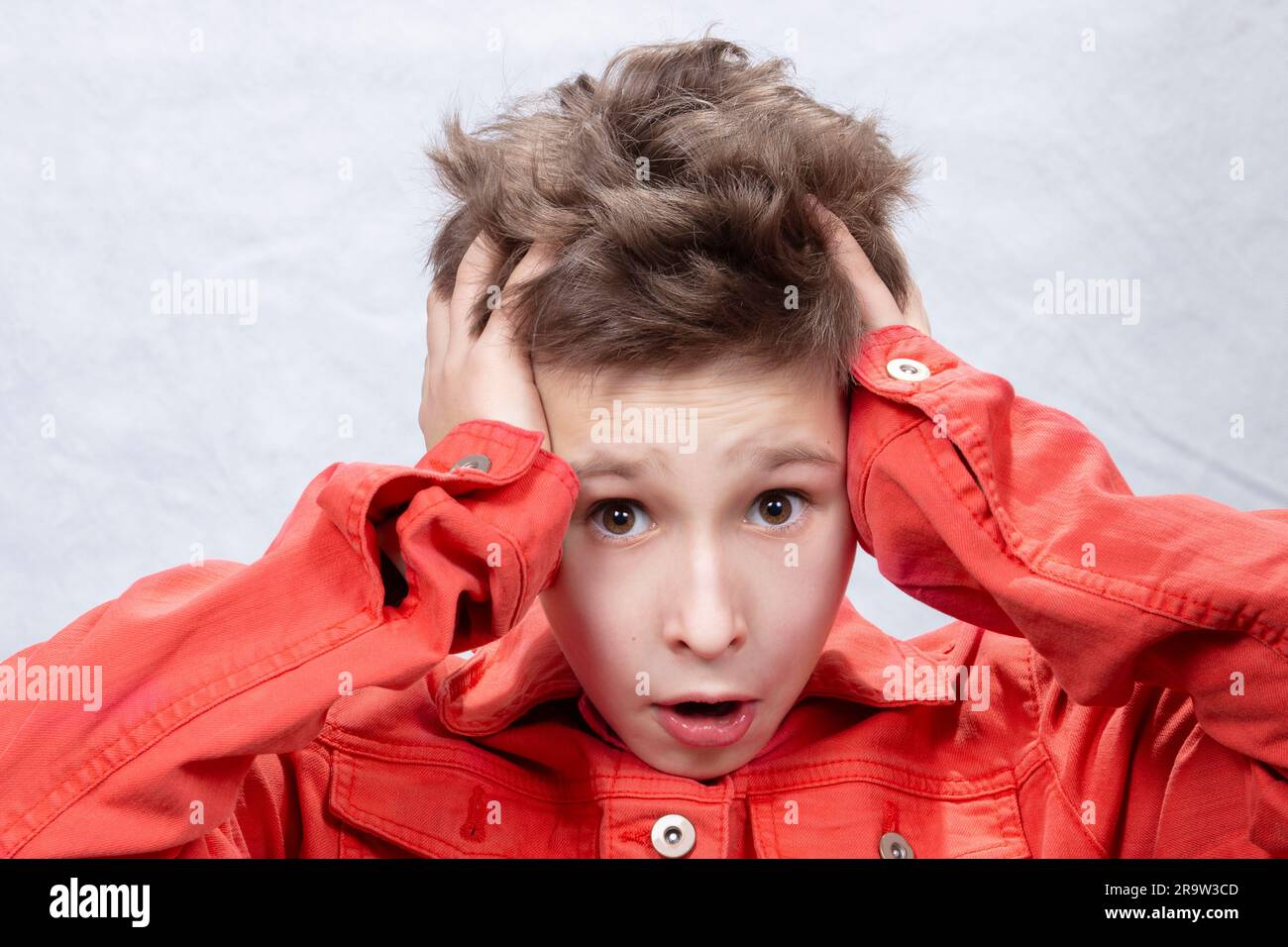 Wow. Studio shot of emotional adorable little boy raising eyebrows ...