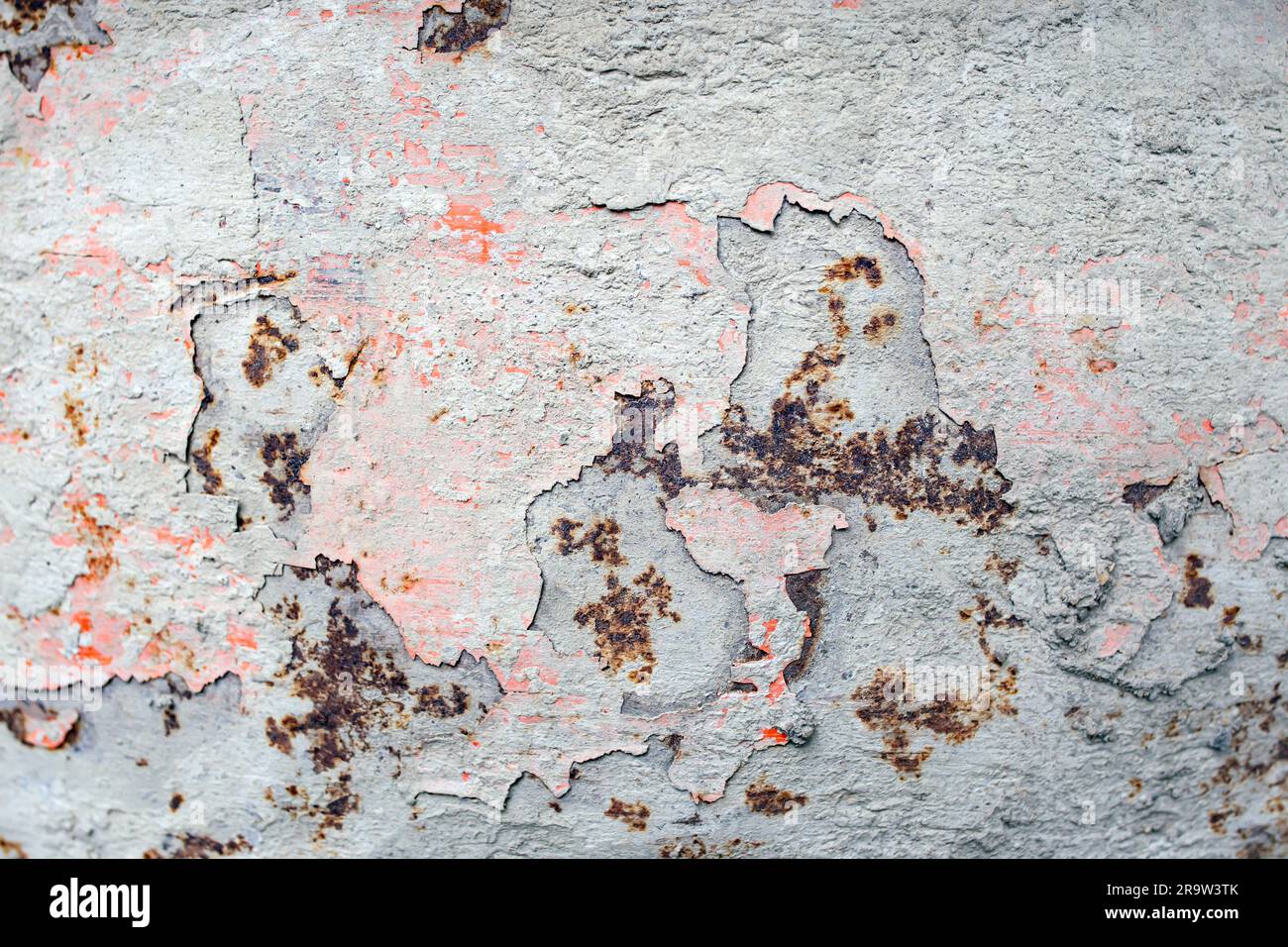 Dried cement, peeling red paint and rust spots on a cement mixer, soft ...