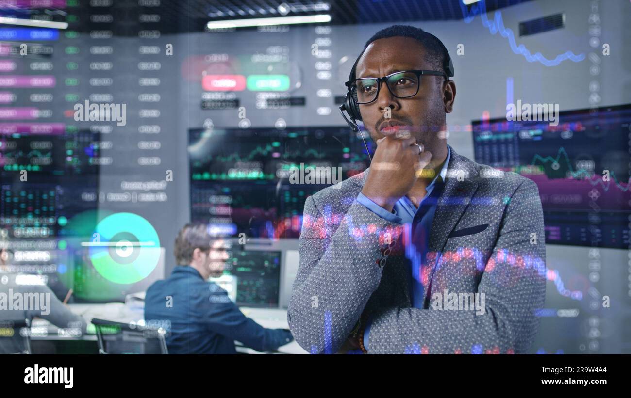 African American investment specialist analyzes real-time stocks in ...