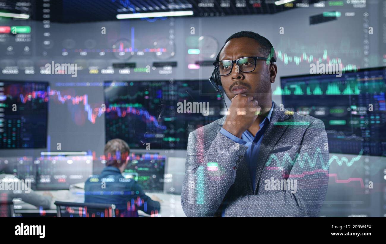 African American trader, businessman works in modern broker agency ...