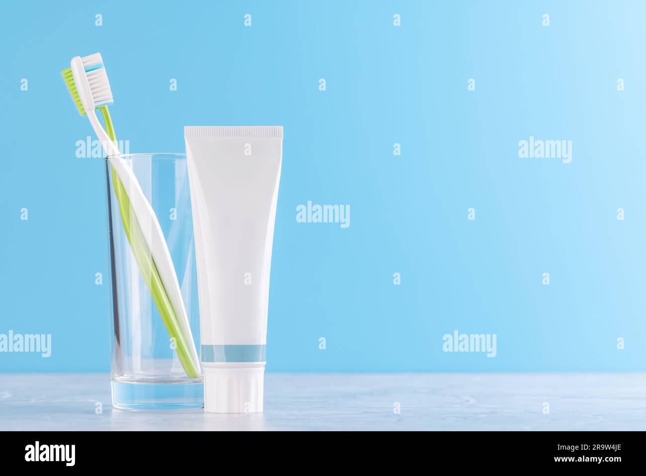 A clean and refreshing image featuring toothpaste and toothbrush ...