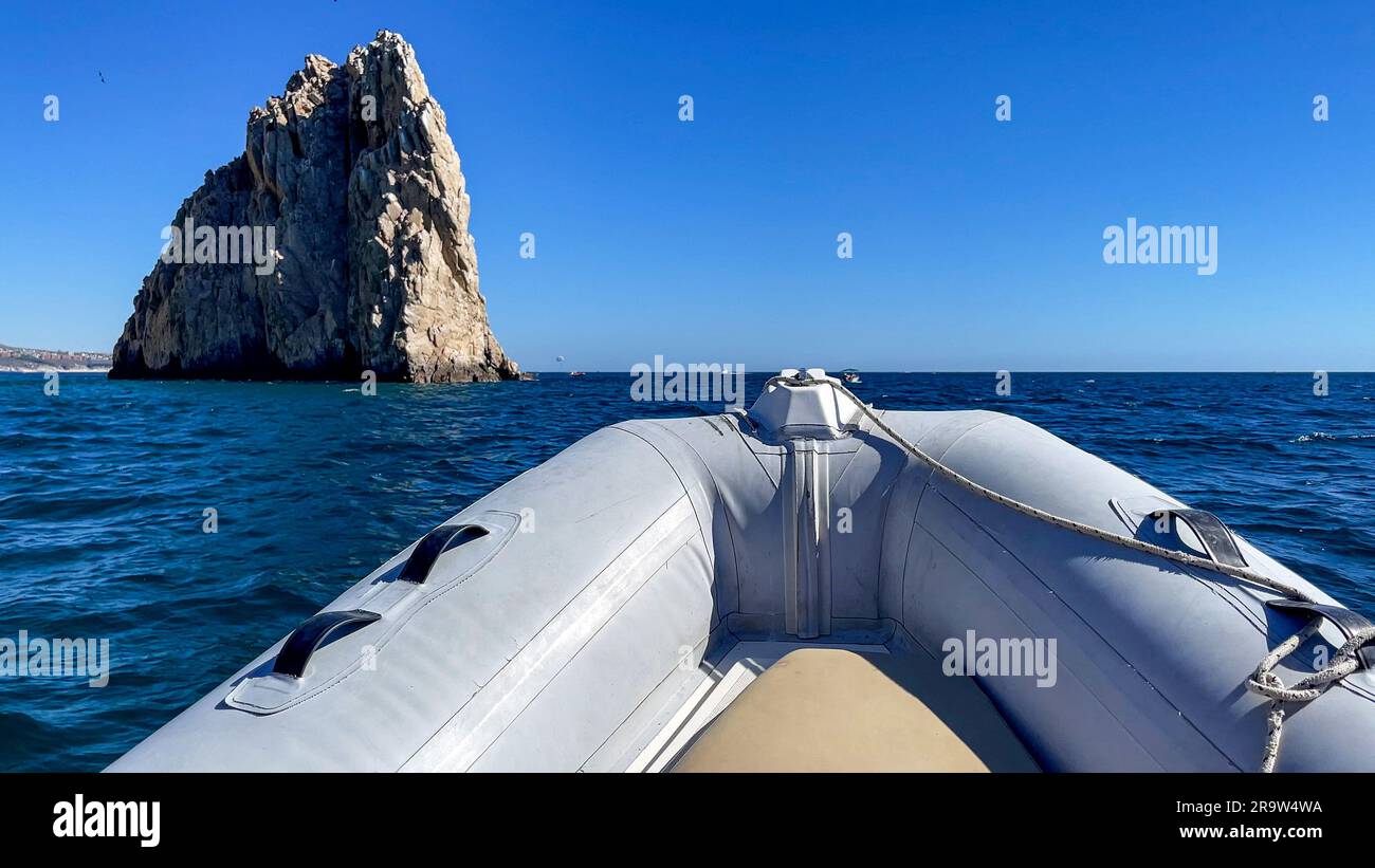 Zodiac cruising the waters towards the Cabo San Lucas arch in the Gulf ...