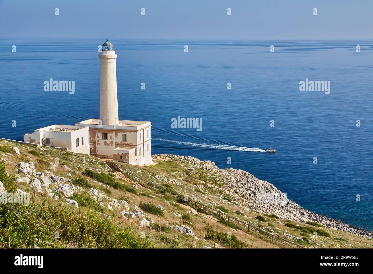 The lighthouse of Cape of Otranto in Apulia standing on hard granite ...