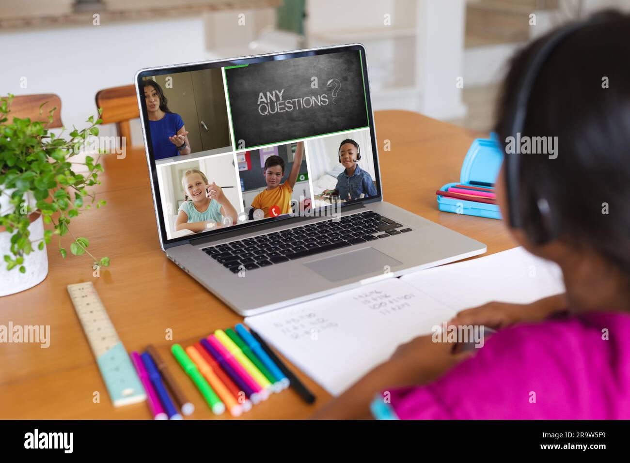 Diverse female teacher and schoolchildren having laptop video call ...