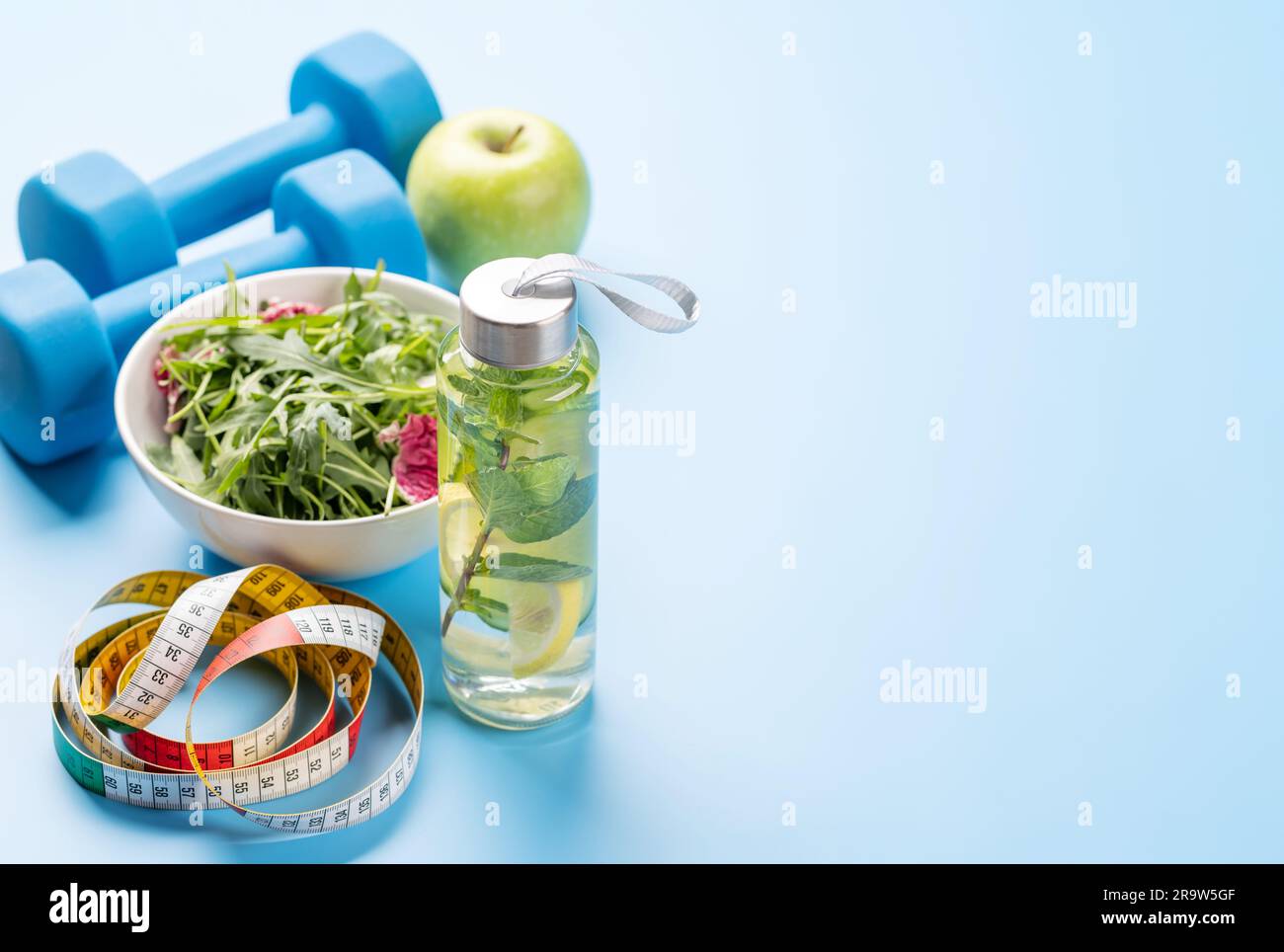 Healthy lifestyle, sport and diet concept. Dumbbells and healthy food ...