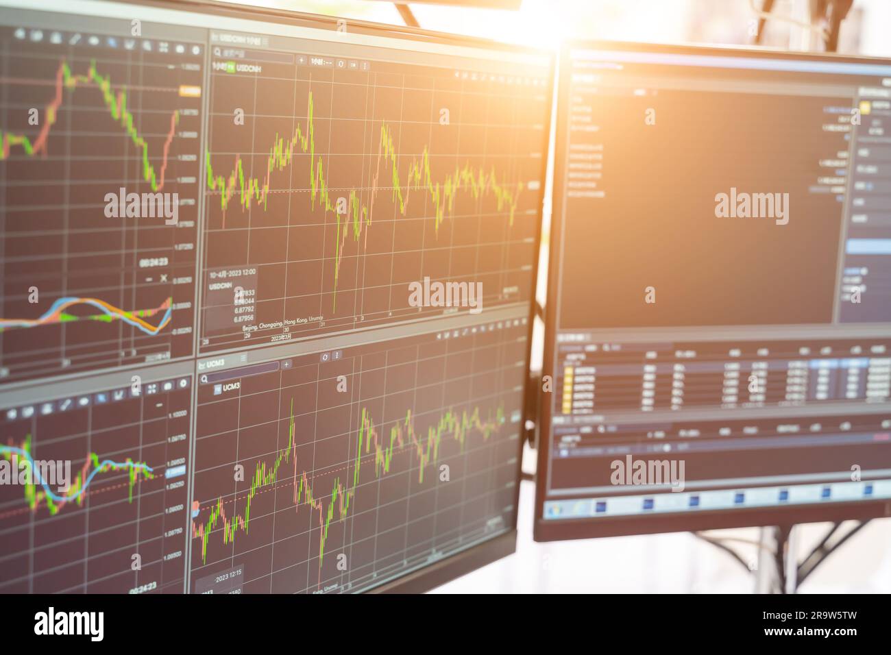 close view of stock market trending screens in modern office. success ...