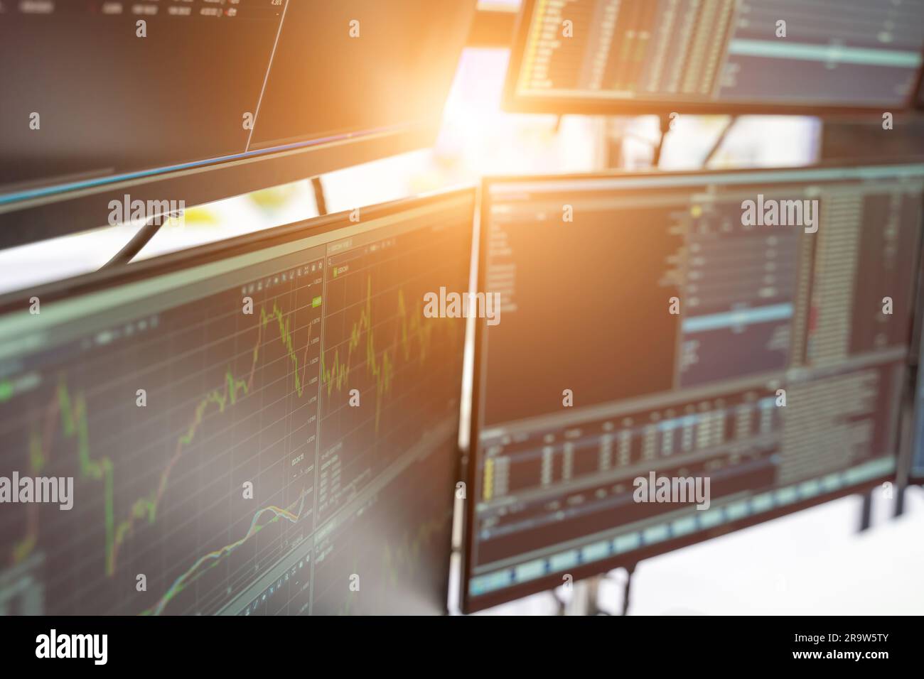 close view of stock market trending screens in modern office. success ...