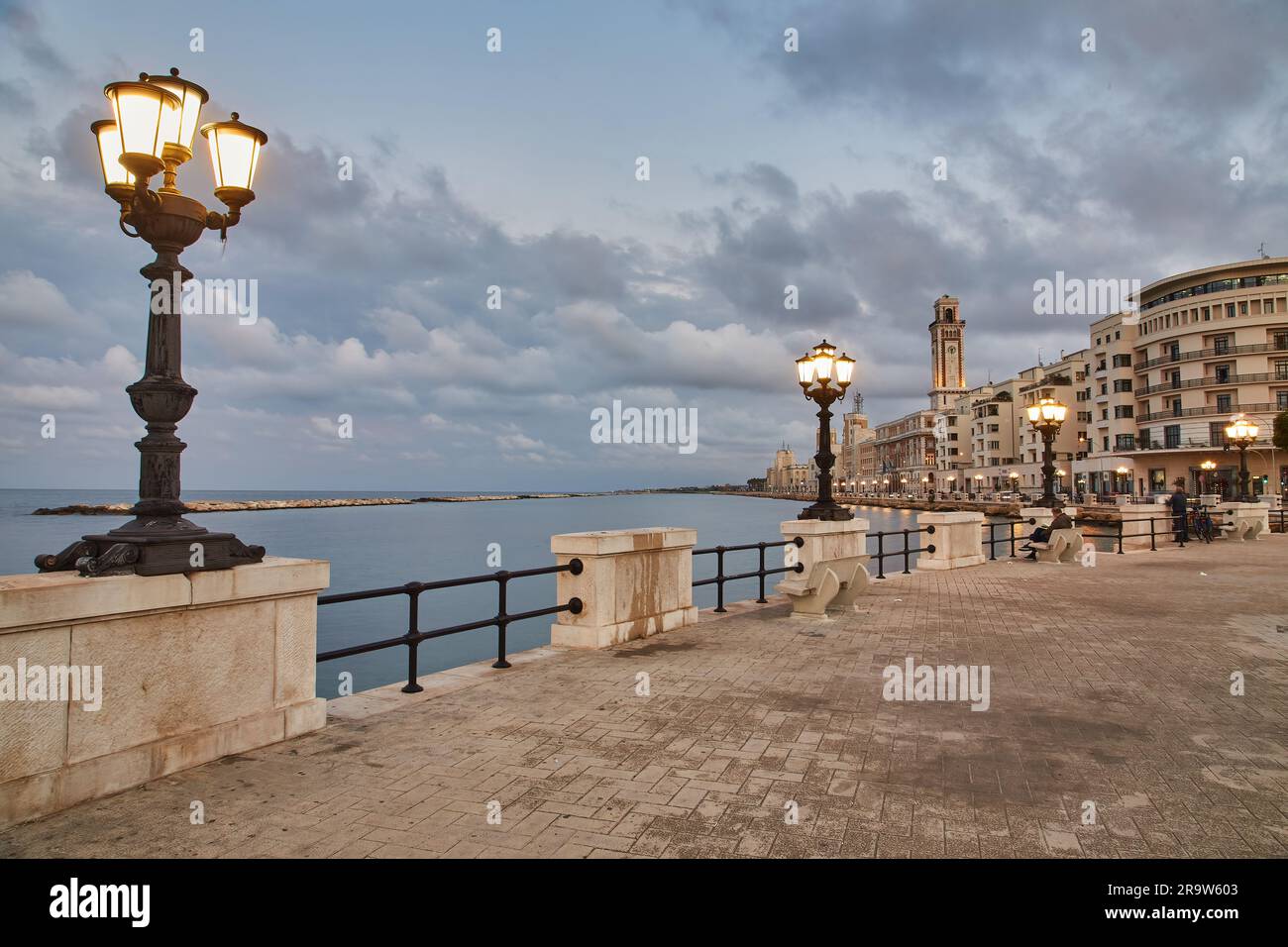 Empty benches and lamp posts at seafront and promenade in Bari, Italy ...