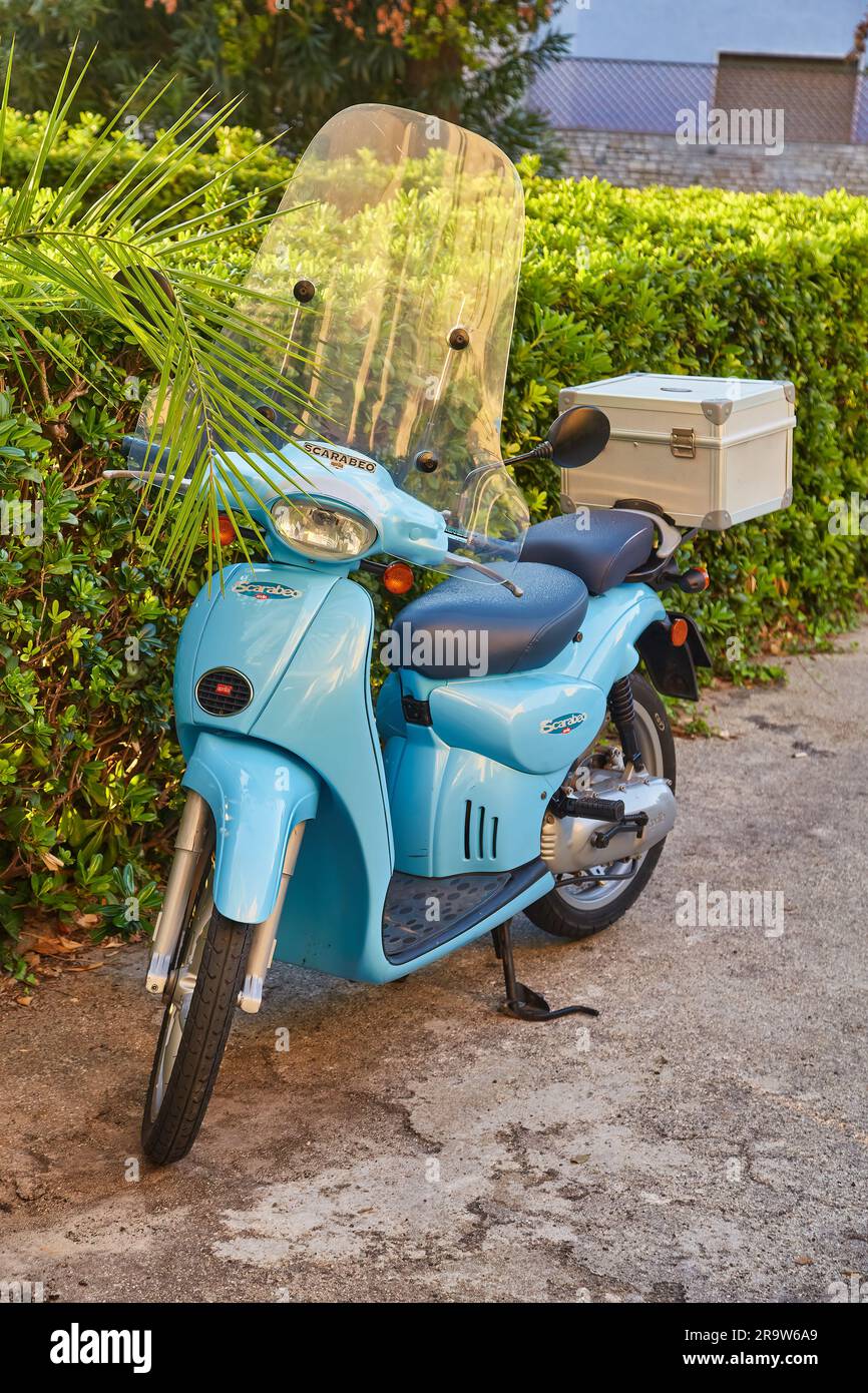 a beautiful retro moped parked on the street of the old town Stock ...