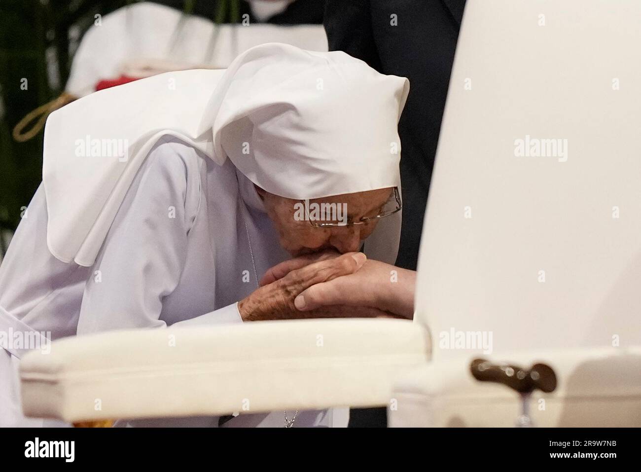 A nun kisses Pope Francis hand before a mass on St. Peter and Paul's ...