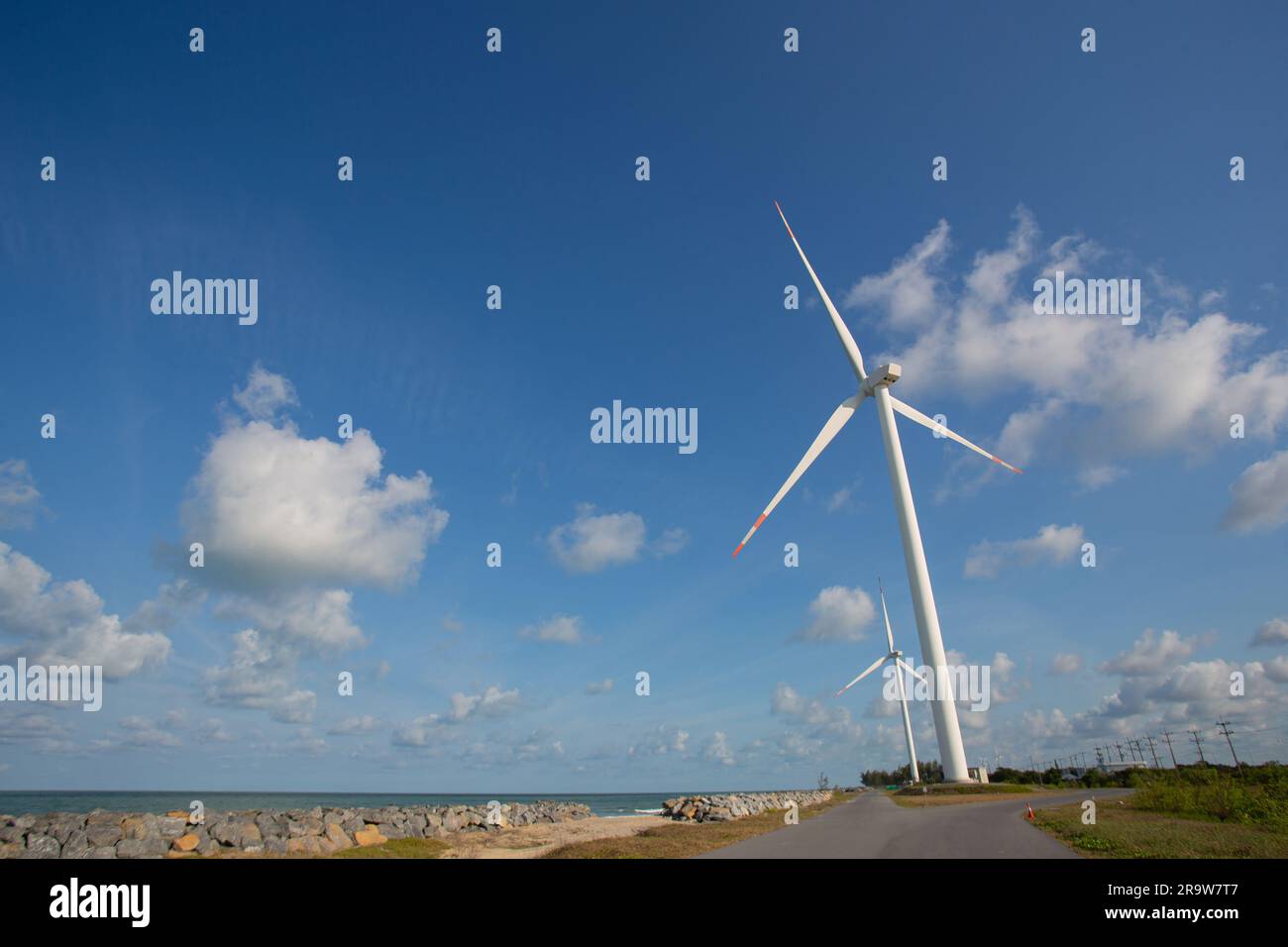 large wind turbines bring electricity from the wind Concept of energy ...
