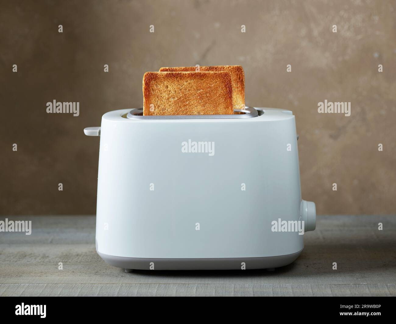 freshly toasted bread slices in toaster Stock Photo - Alamy