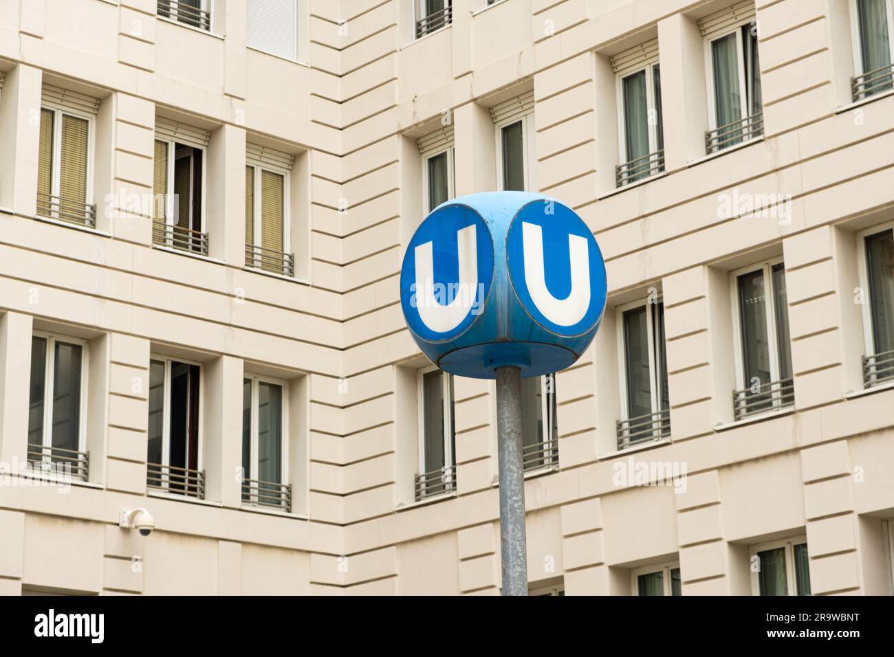 A subway U sign in Vienna in Austria on the background of a building ...