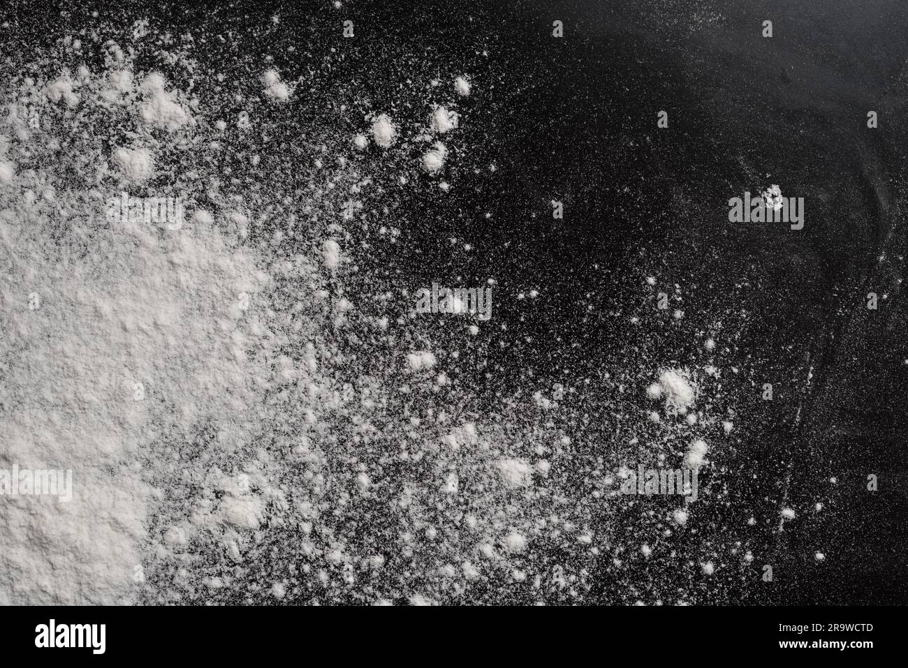 Wheat flour on black background Stock Photo - Alamy