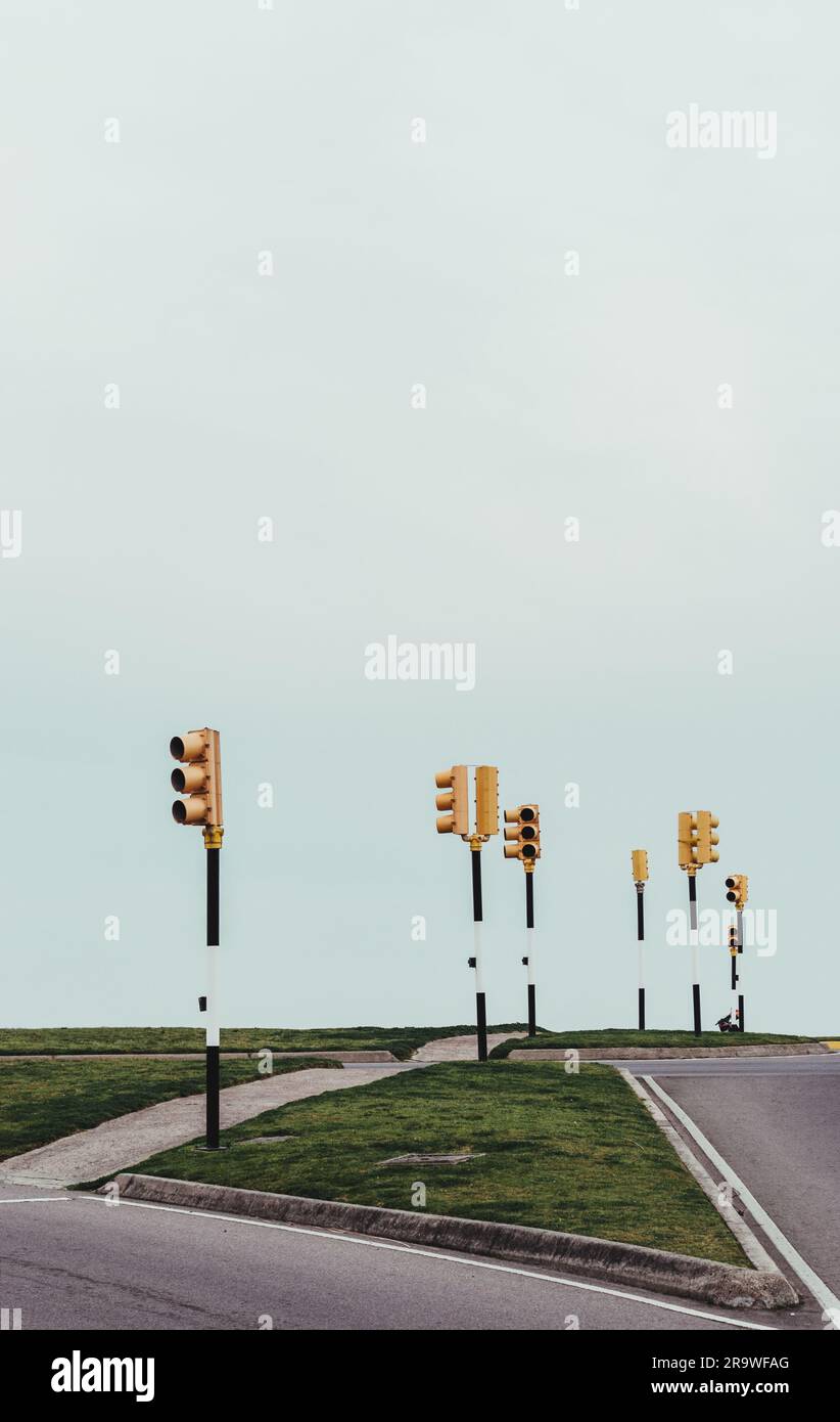 An empty road with multiple yellow traffic lights Stock Photo - Alamy