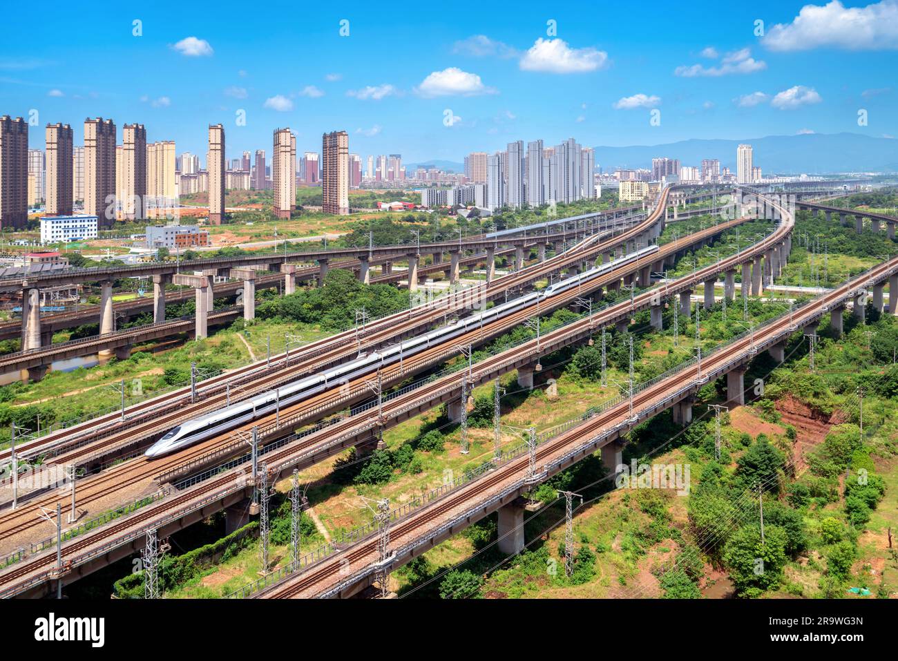 High-speed train crosses railway transportation hub Stock Photo - Alamy