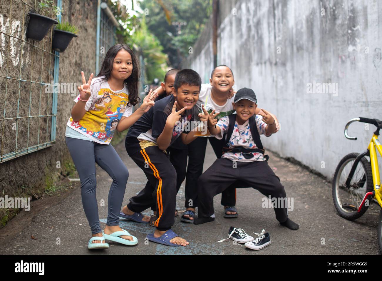 Jakarta, Indonesia - May 30, 2023: Group of children in a small alley ...