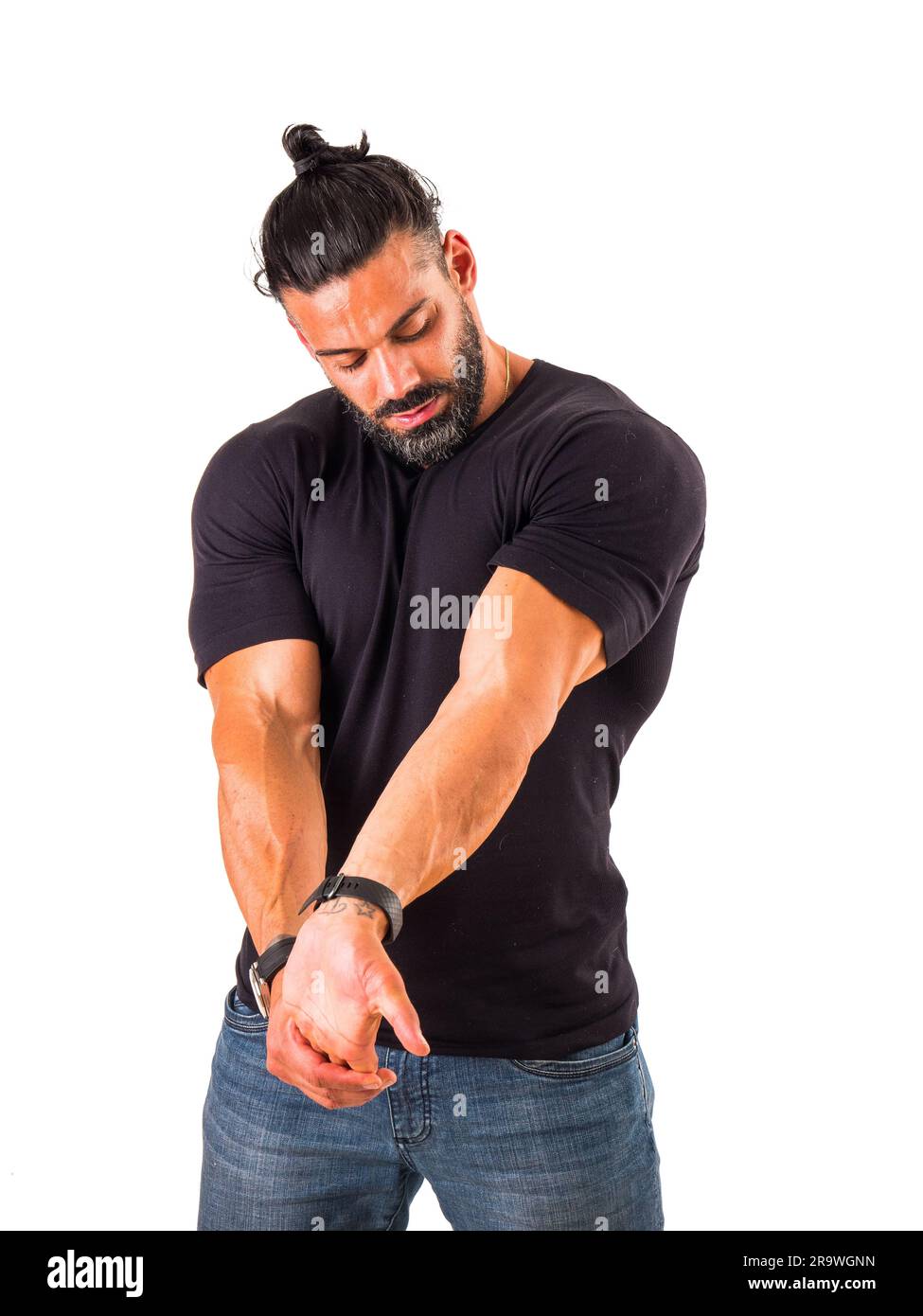 Handsome muscular man stretching arm and shoulder in studio Stock Photo ...